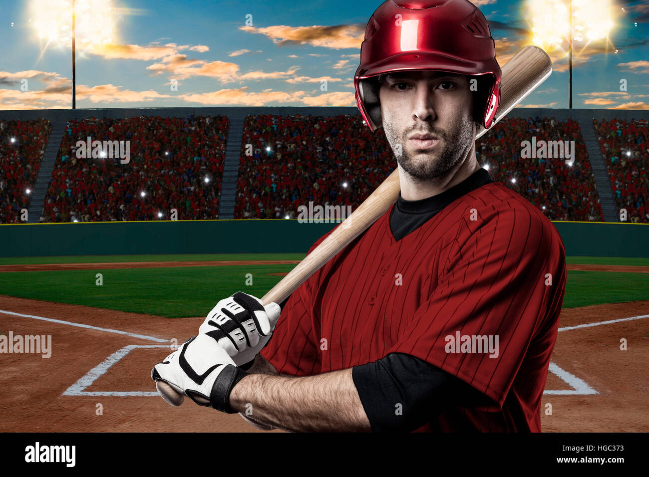 Baseball Player with a red uniform on baseball Stadium Stock Photo - Alamy