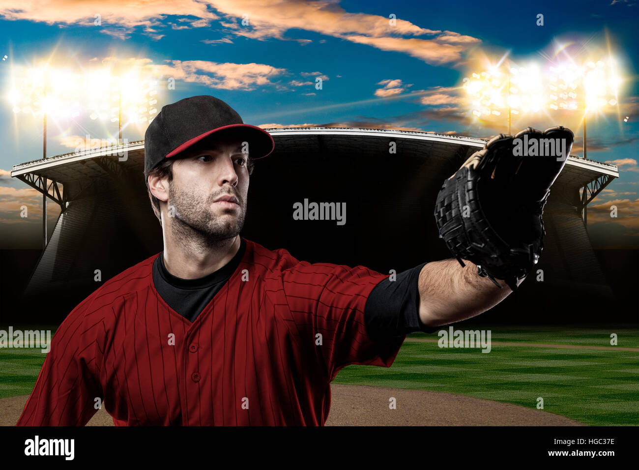 Baseball Player with a red uniform on baseball Stadium Stock Photo - Alamy