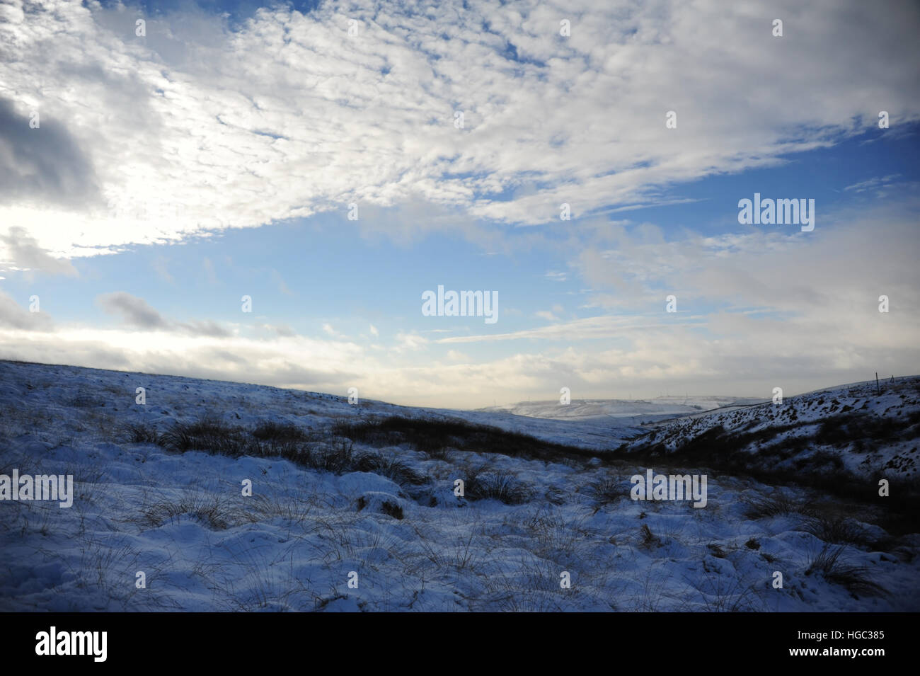 Pennine Way at A640 Huddersfield Road, looking west down snowy ...