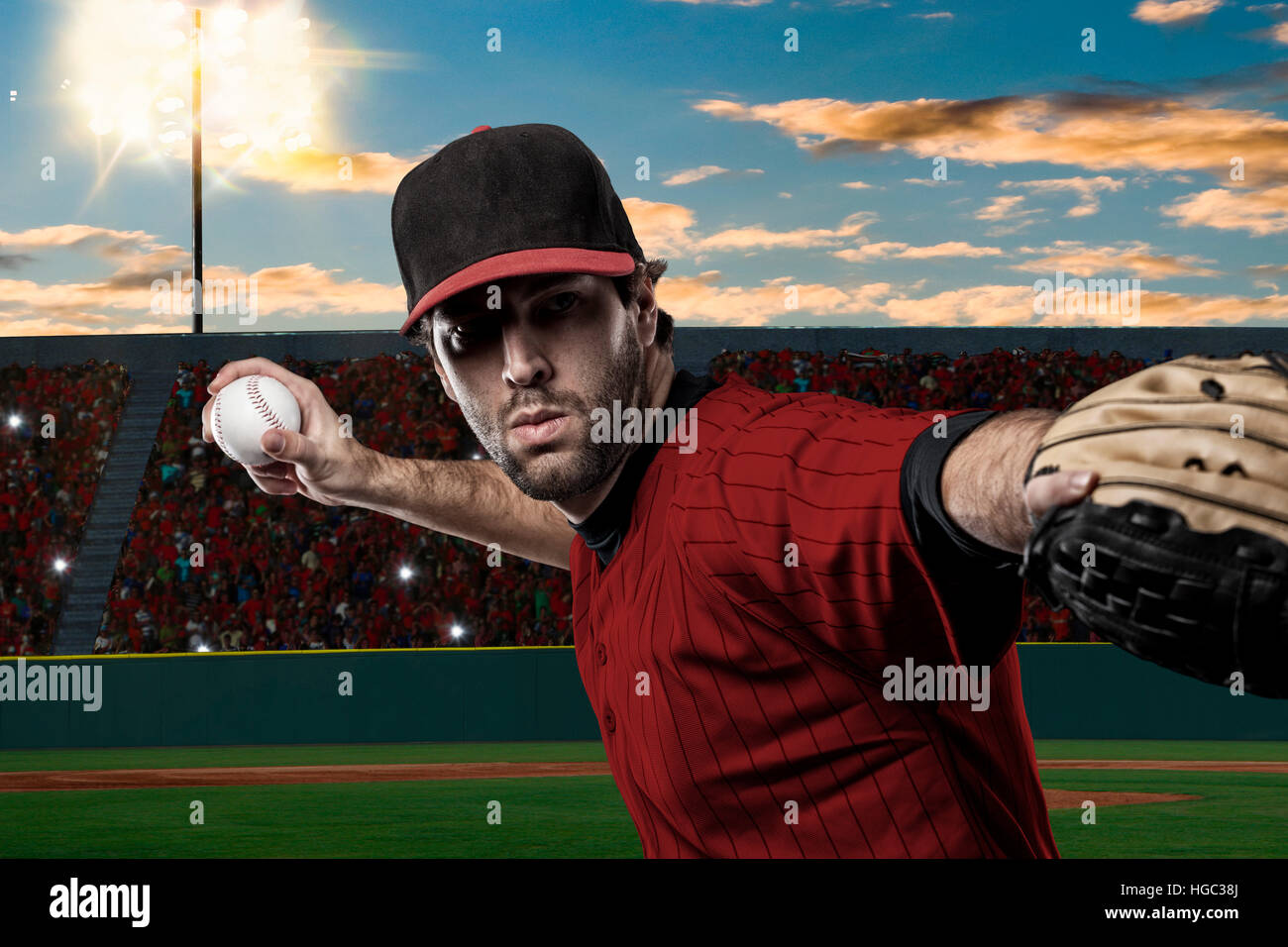 Baseball Player with a red uniform on baseball Stadium Stock Photo - Alamy