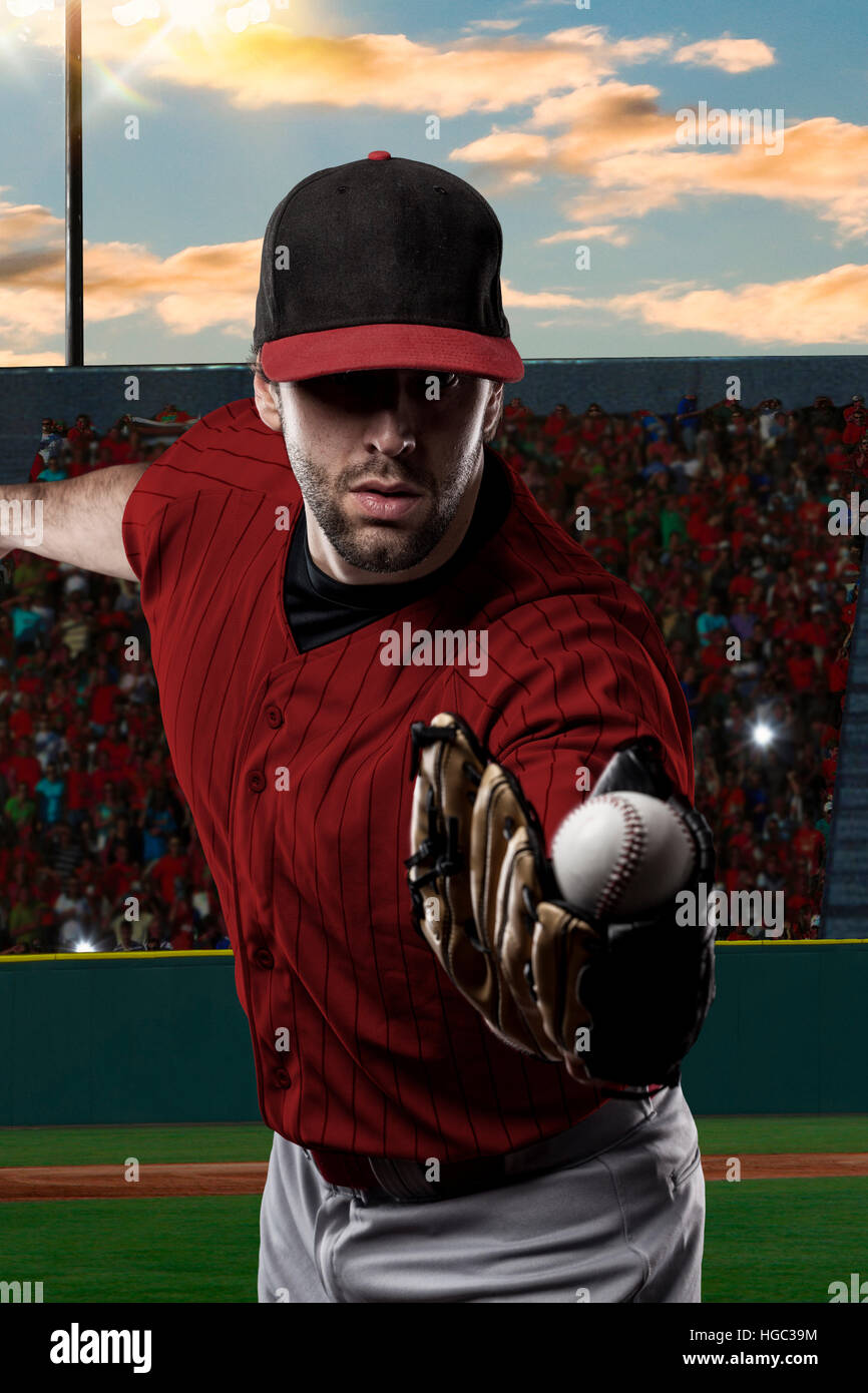 Baseball Player with a red uniform on baseball Stadium Stock Photo - Alamy