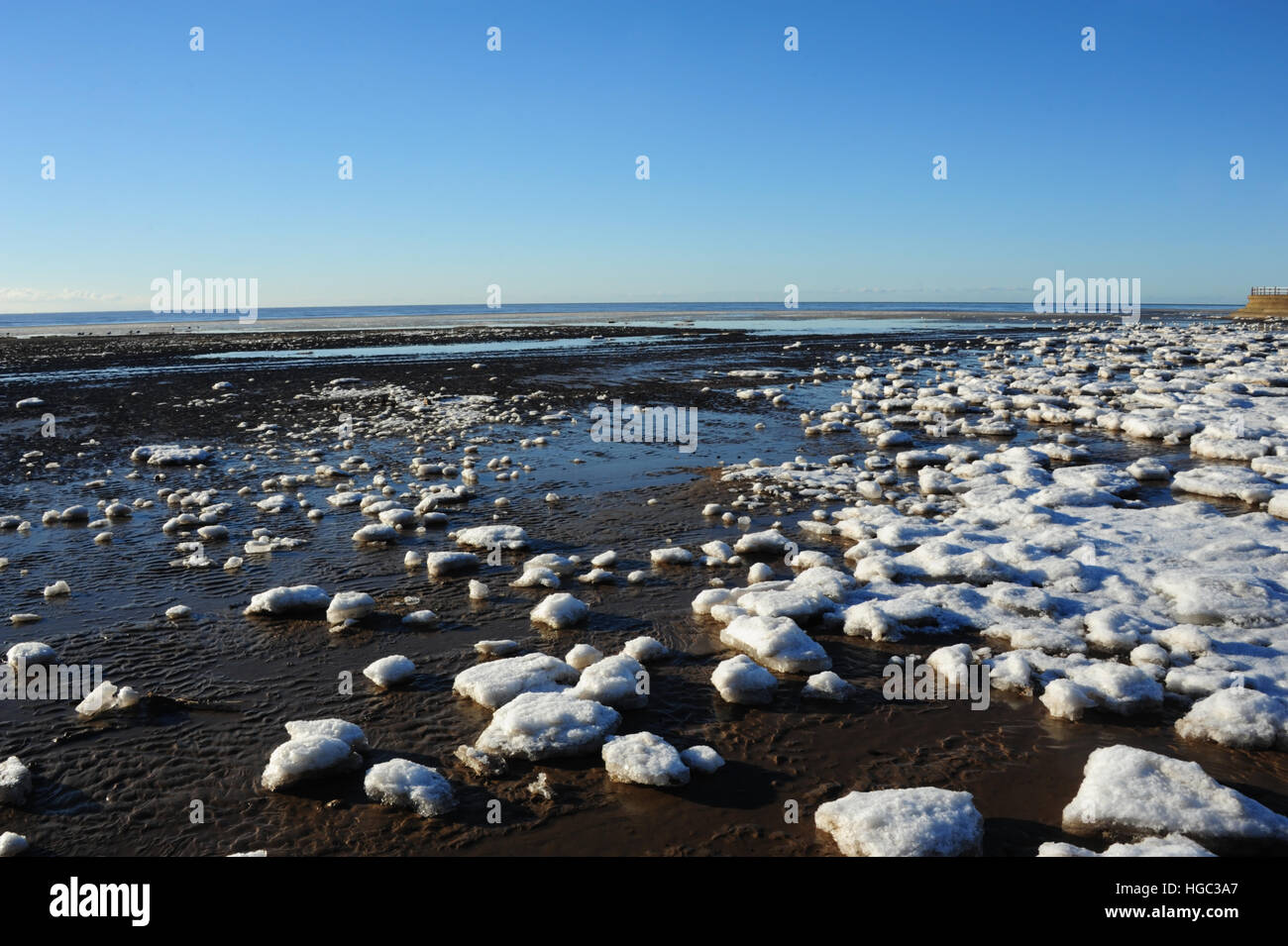 Many isolated white land fast sea ice blocks lying sand surface hi-res ...