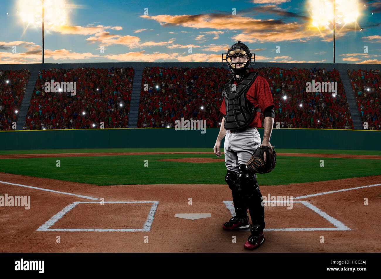 Catcher Baseball Player with a red uniform on a baseball Stadium Stock ...