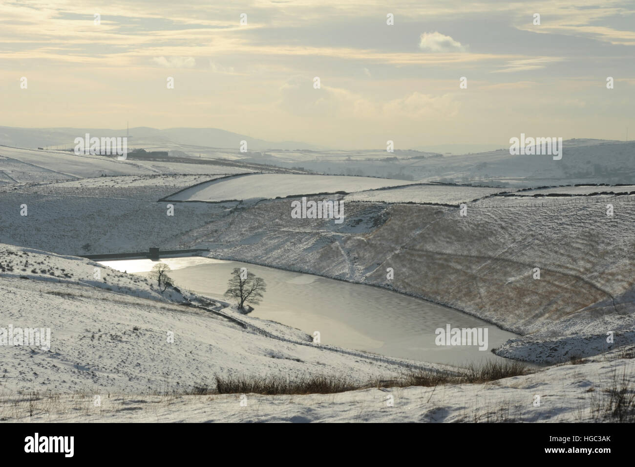 Blue sky white clouds sunny day view frozen water Crook Gate Reservoir ...