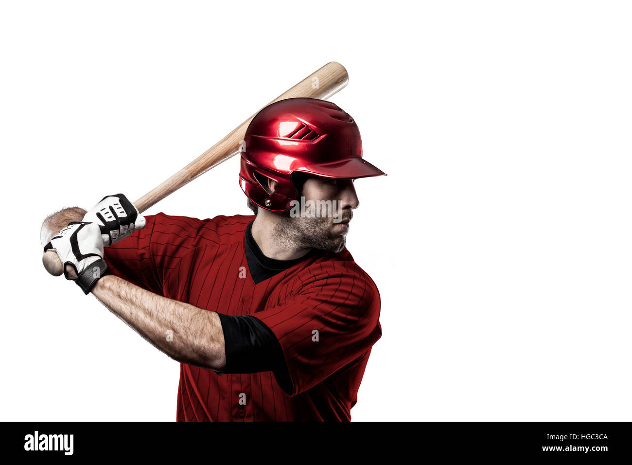 Baseball Player with a red uniform on white background Stock Photo - Alamy