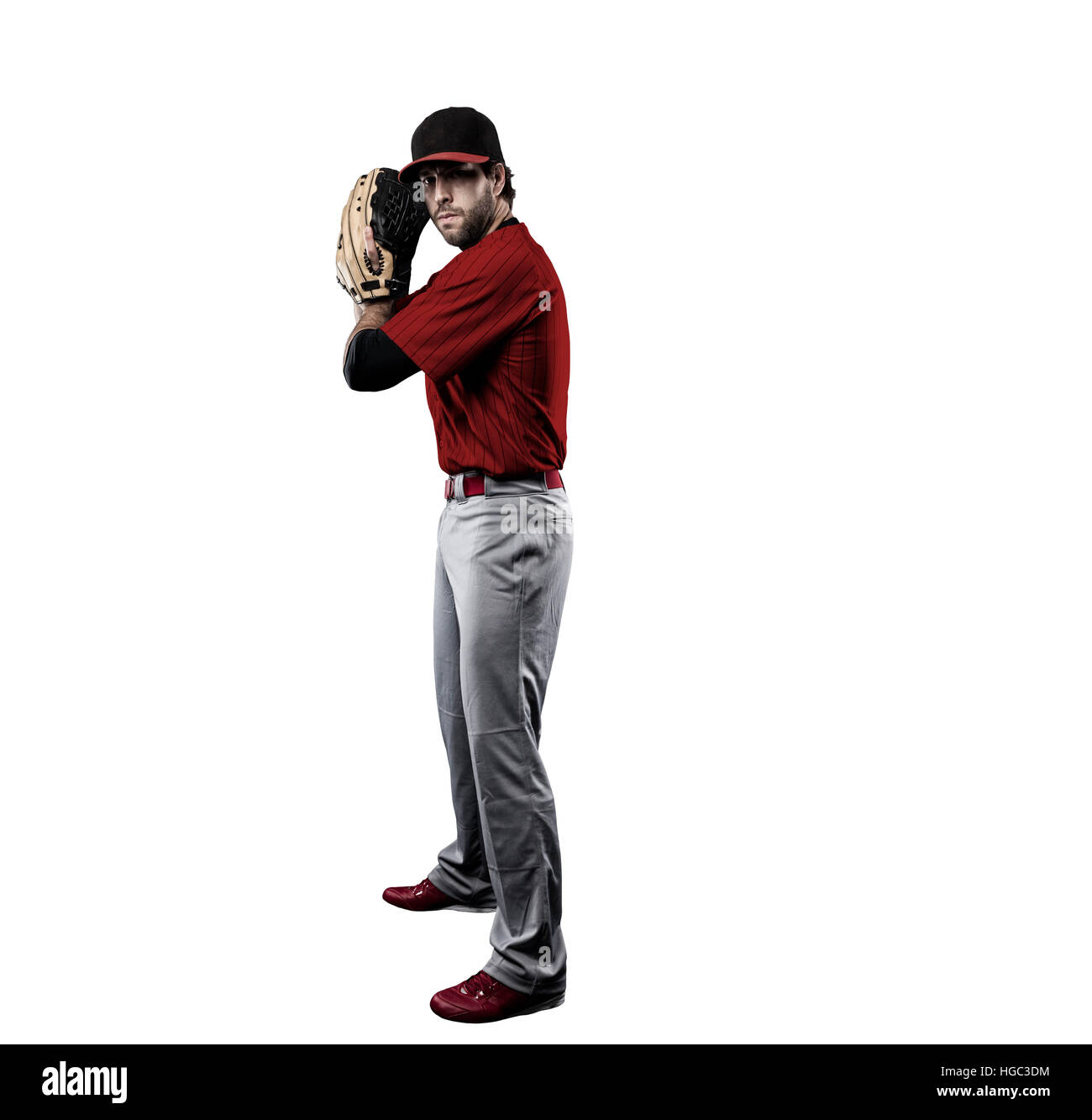 Pitcher Baseball Player with a red uniform on a white background Stock ...
