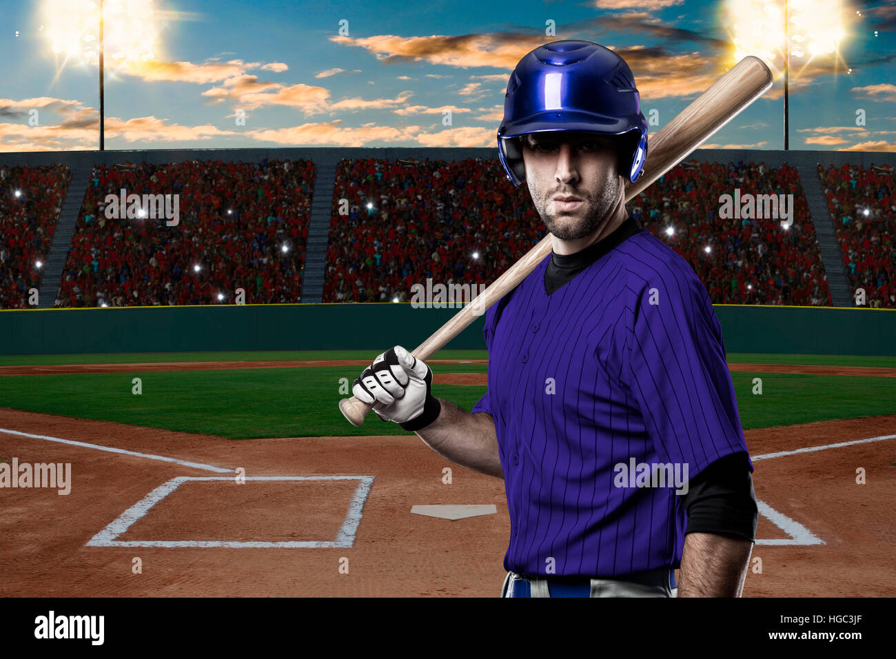 Baseball Player with a blue uniform on baseball Stadium Stock Photo - Alamy
