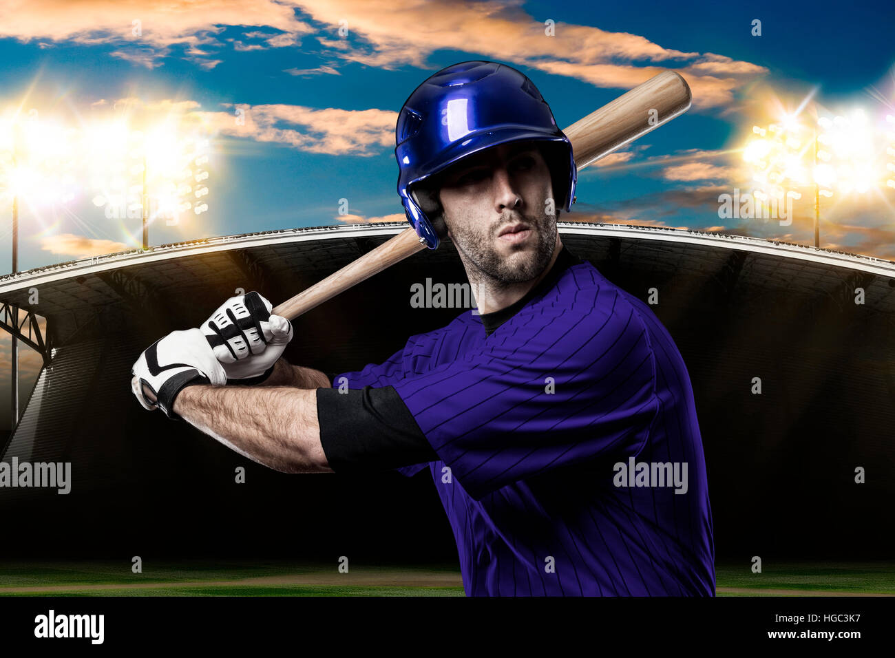 Baseball Player with a blue uniform on baseball Stadium Stock Photo - Alamy