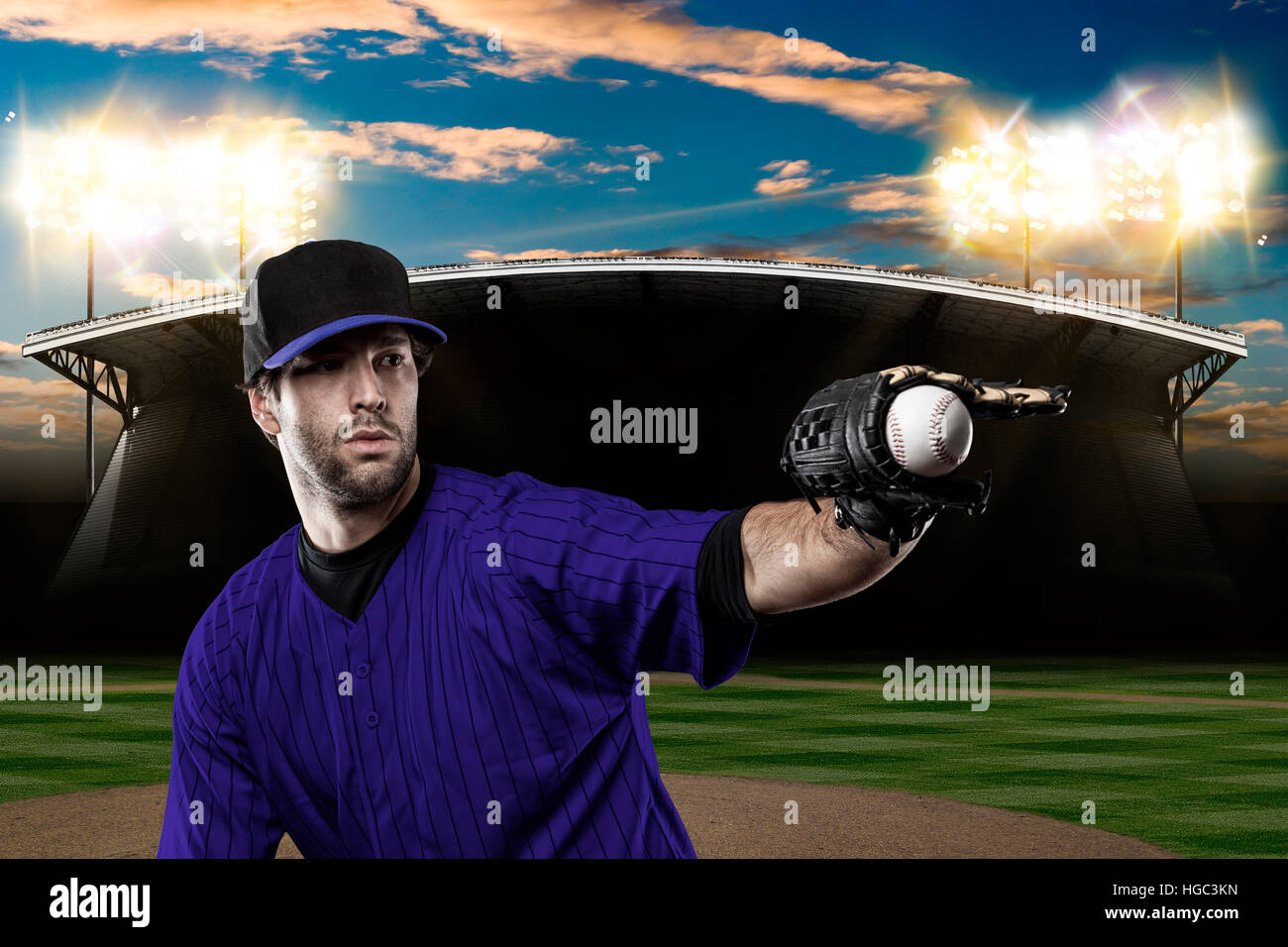 Baseball Player with a blue uniform on baseball Stadium Stock Photo - Alamy
