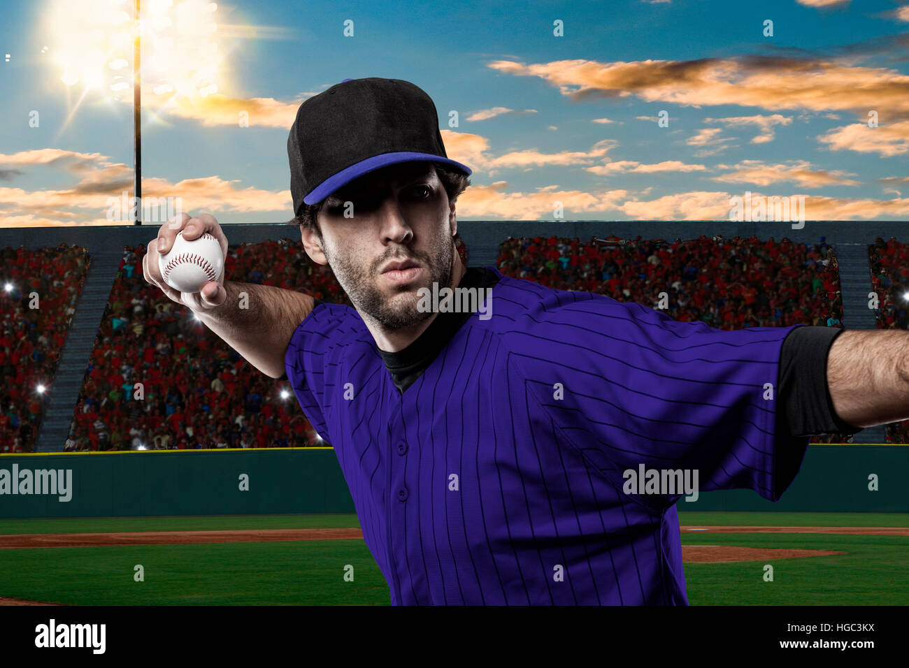 Baseball Player with a blue uniform on baseball Stadium Stock Photo - Alamy