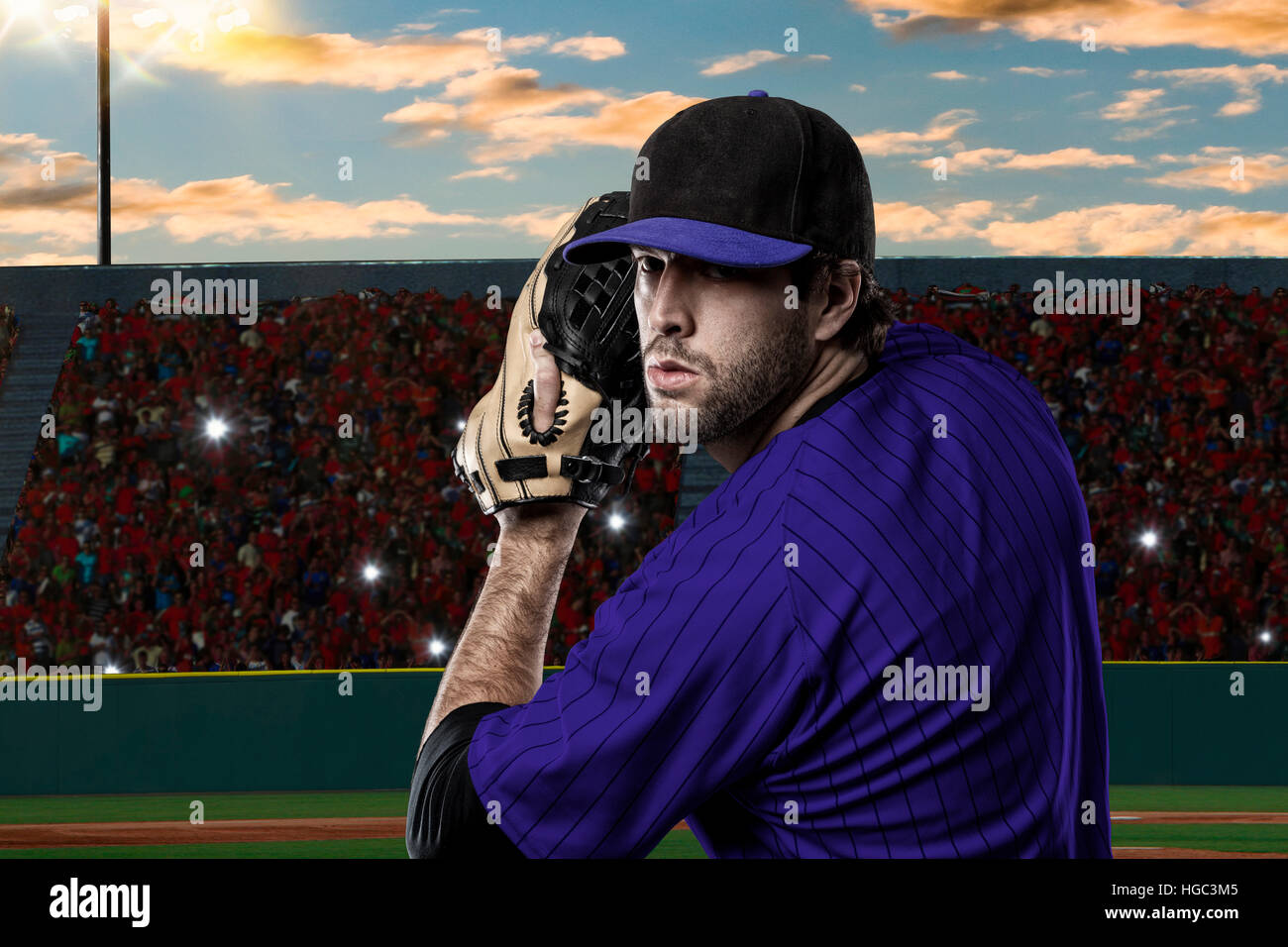 Pitcher Baseball Player with a blue uniform on baseball Stadium Stock ...