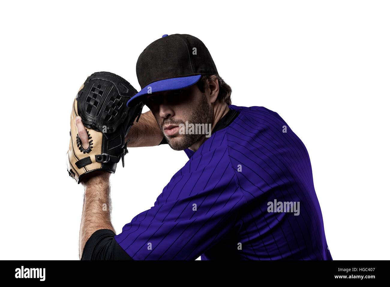Baseball Player with a blue uniform on a white background Stock Photo ...