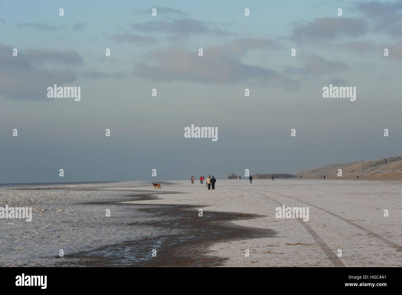 Blue sky grey clouds view towards beach-top sand-winning workings and ...