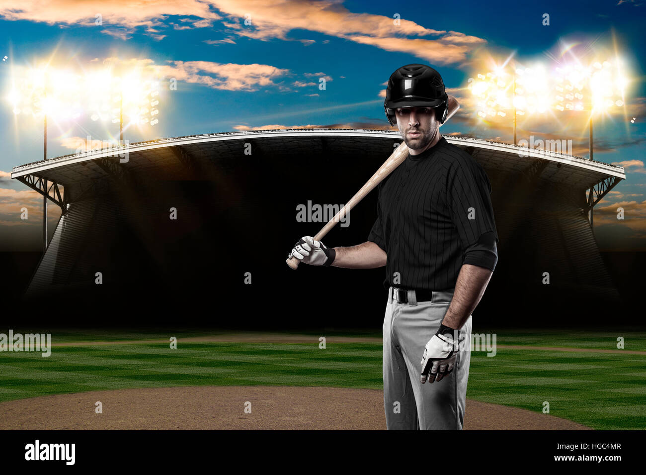 Baseball Player with a black uniform on baseball Stadium Stock Photo ...