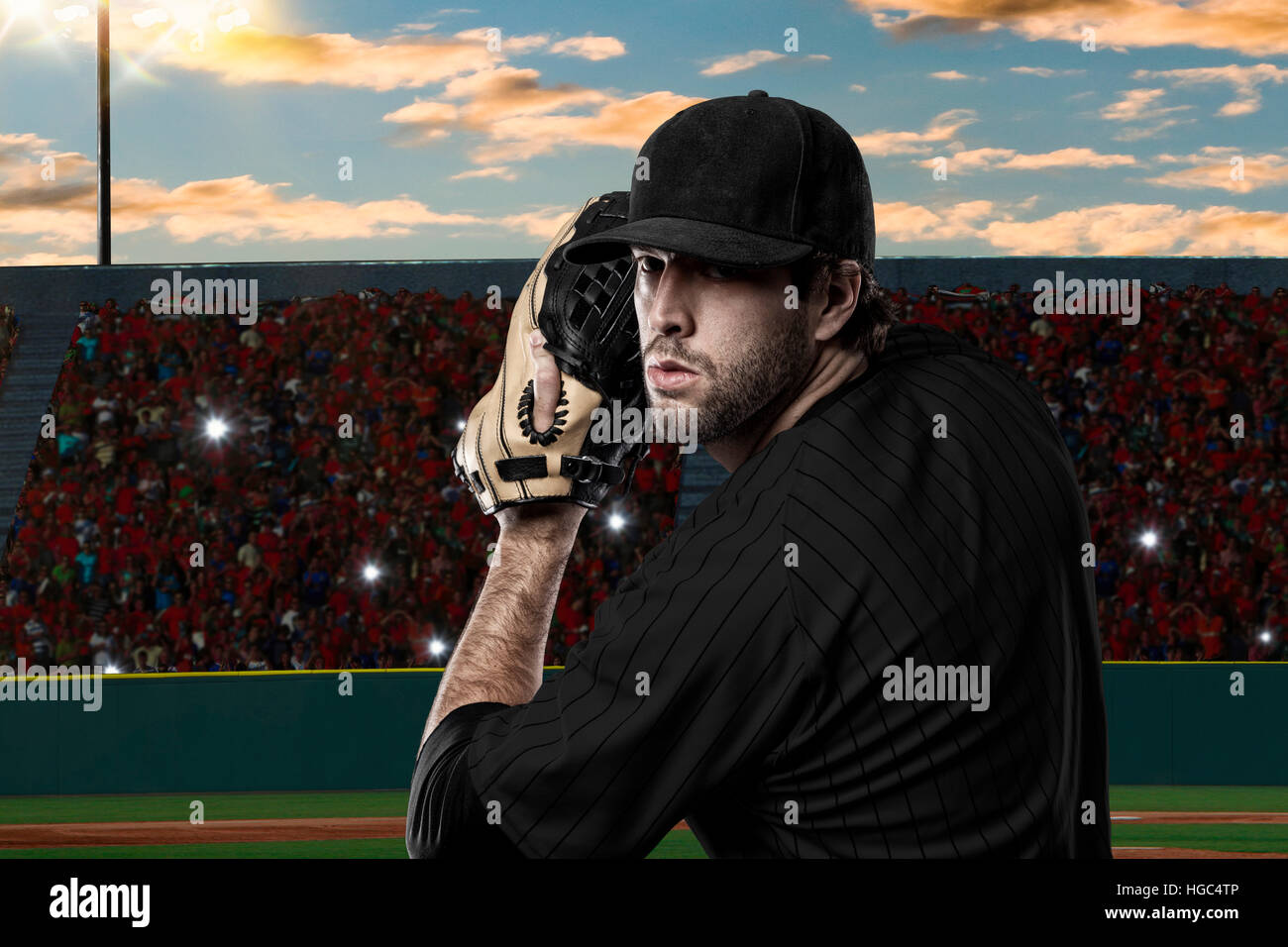 Pitcher Baseball Player with a black uniform on baseball Stadium Stock ...
