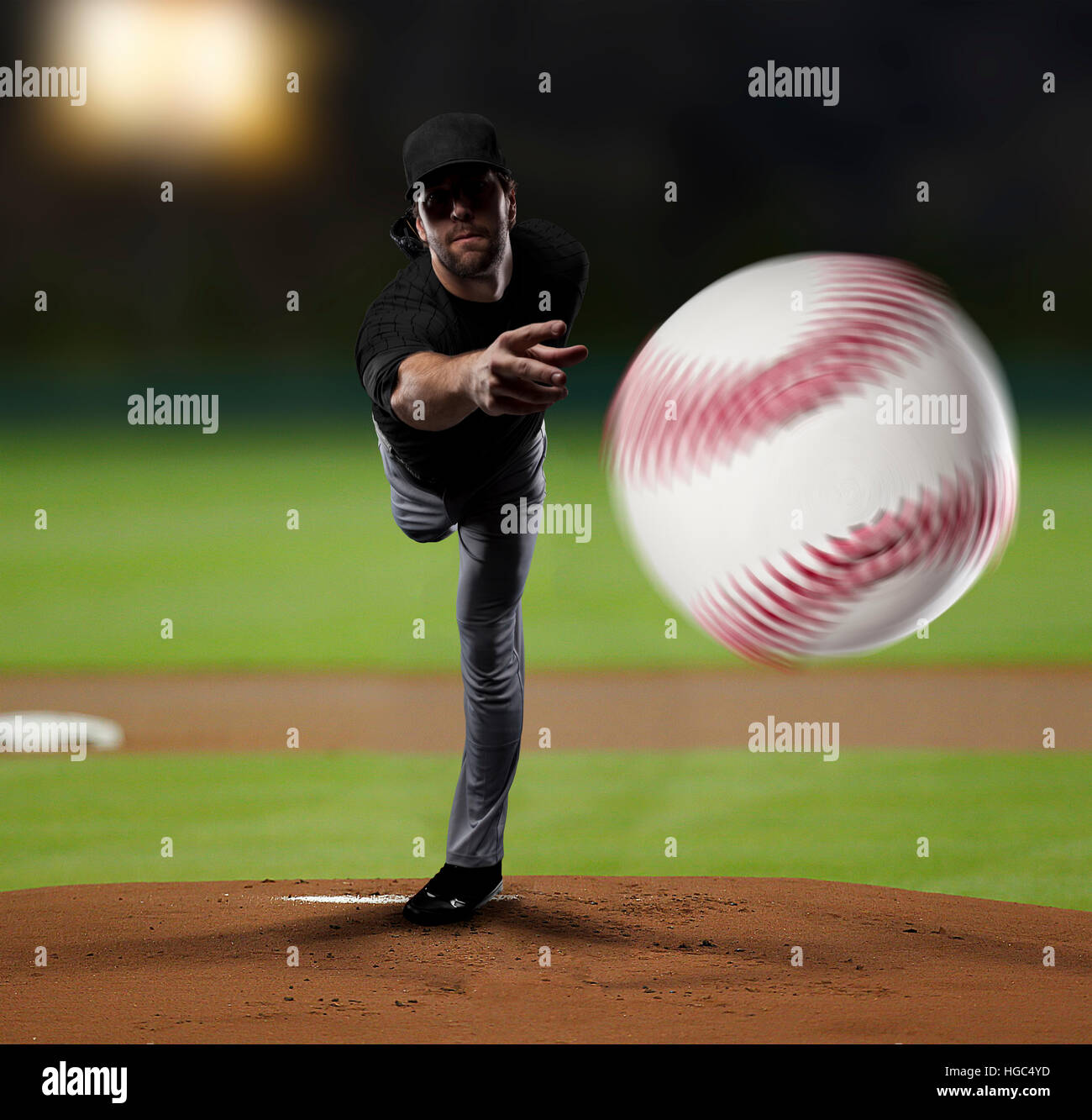 Pitcher Baseball Player with a black uniform on baseball Stadium Stock ...