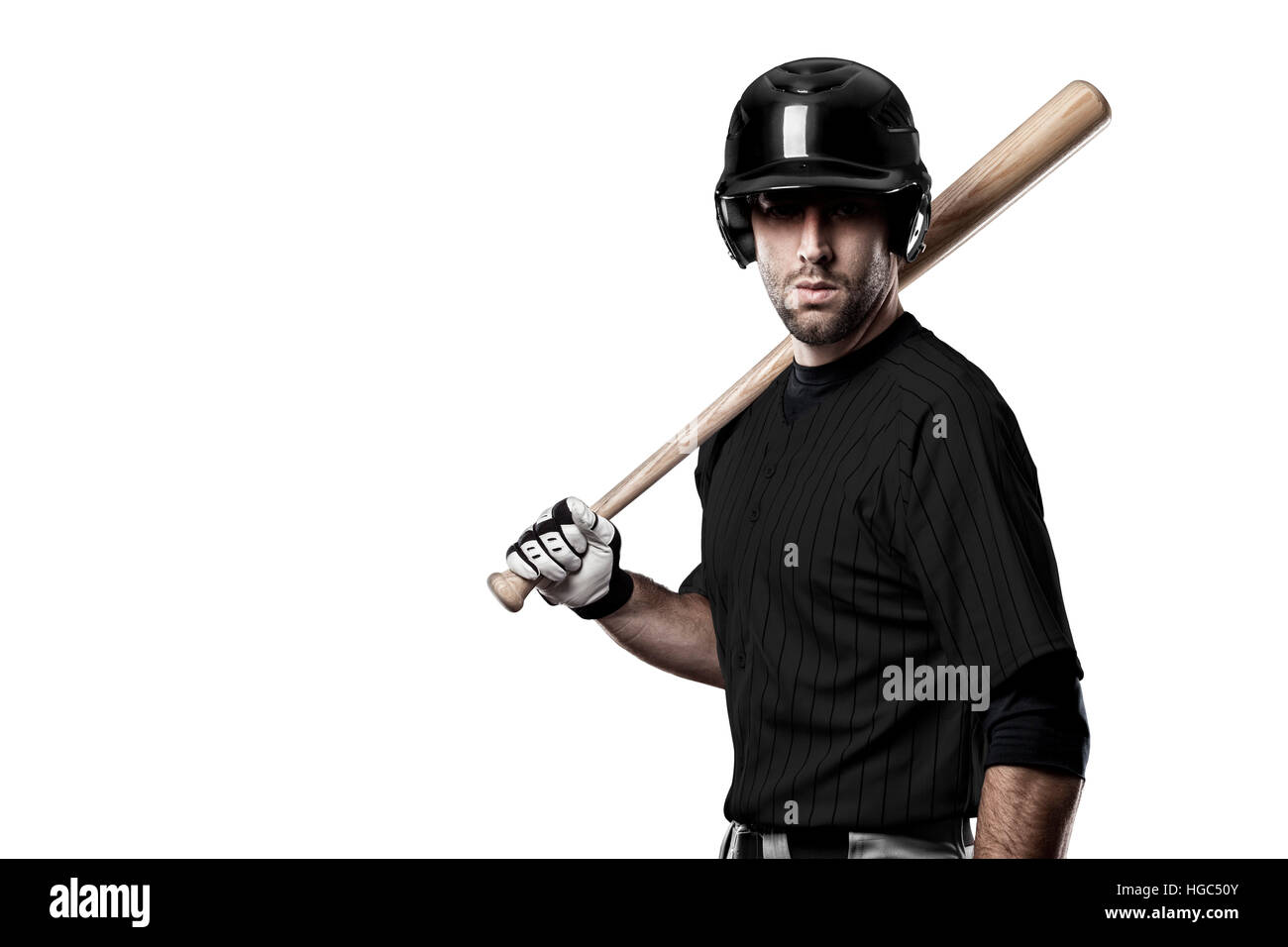Baseball Player with a black uniform on a white background Stock Photo ...