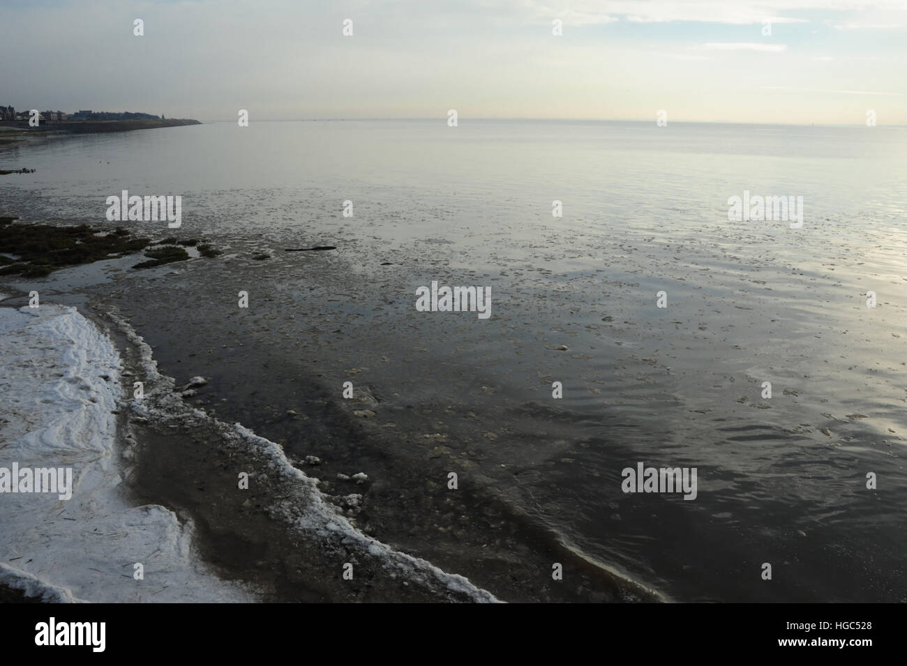Sea ice beach and high tide seawater with ice floes, Fairhaven Outer ...