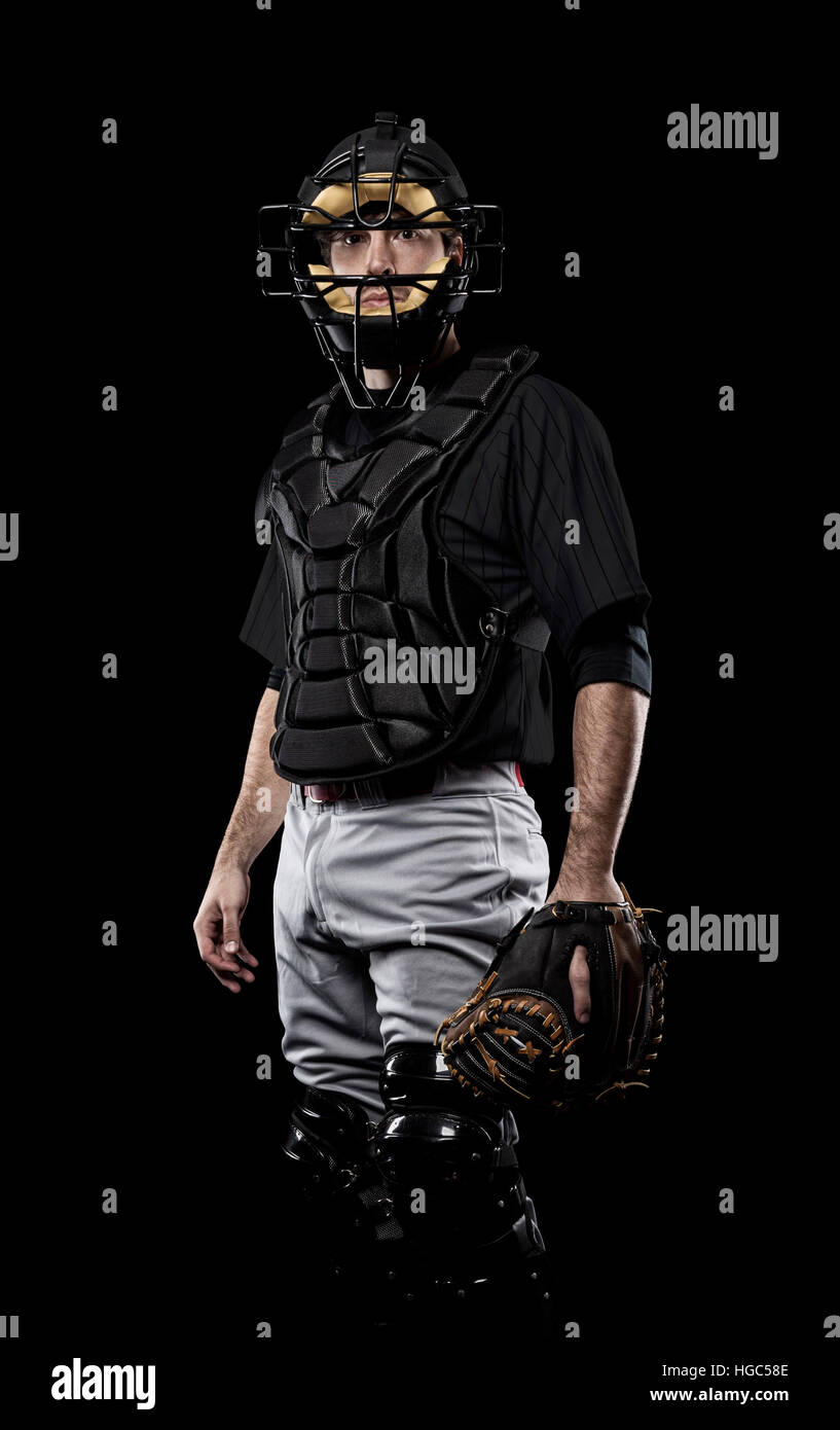 Catcher Player with a black uniform on a black background Stock Photo ...