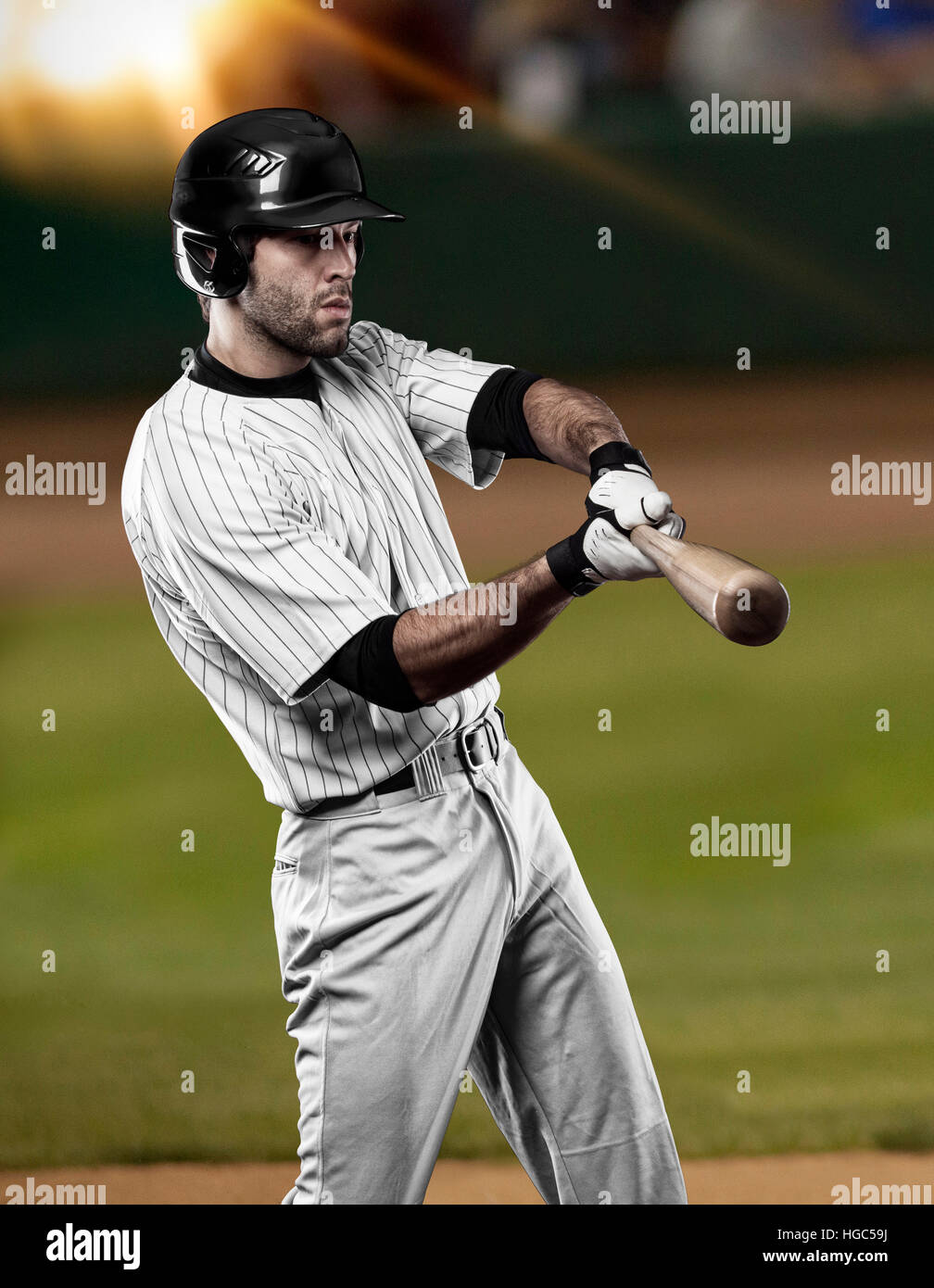 Baseball Player with a white uniform on baseball Stadium Stock Photo ...