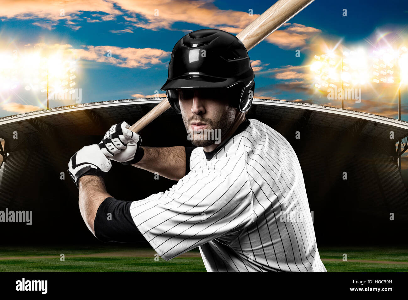 Baseball Player with a white uniform on baseball Stadium Stock Photo ...