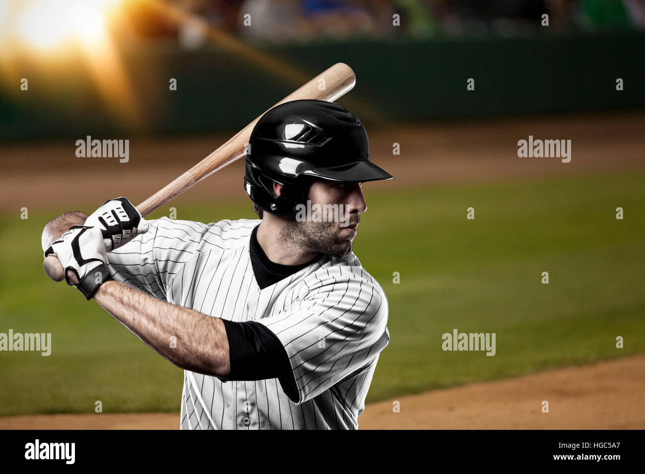 Baseball Player with a white uniform on baseball Stadium Stock Photo ...