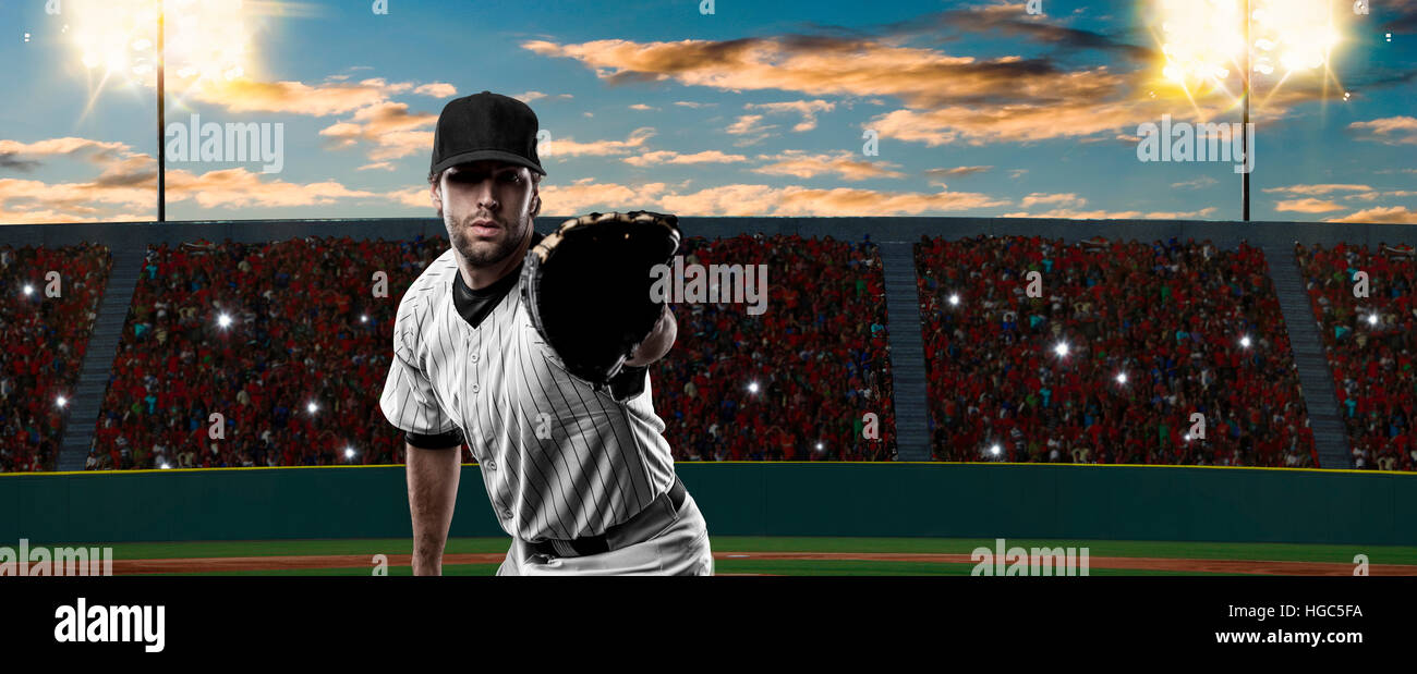Baseball Player with a white uniform on baseball Stadium Stock Photo ...