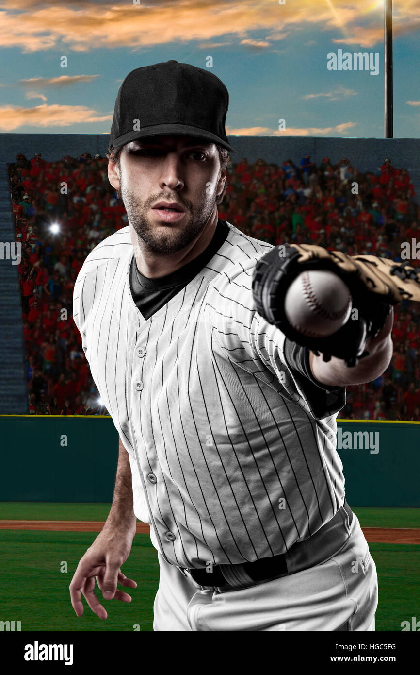 Baseball Player with a white uniform on baseball Stadium Stock Photo ...