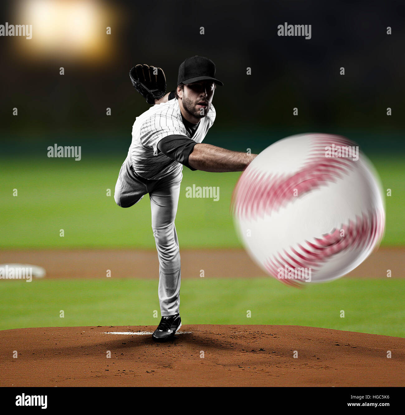 Pitcher Baseball Player with a white uniform on baseball Stadium Stock ...