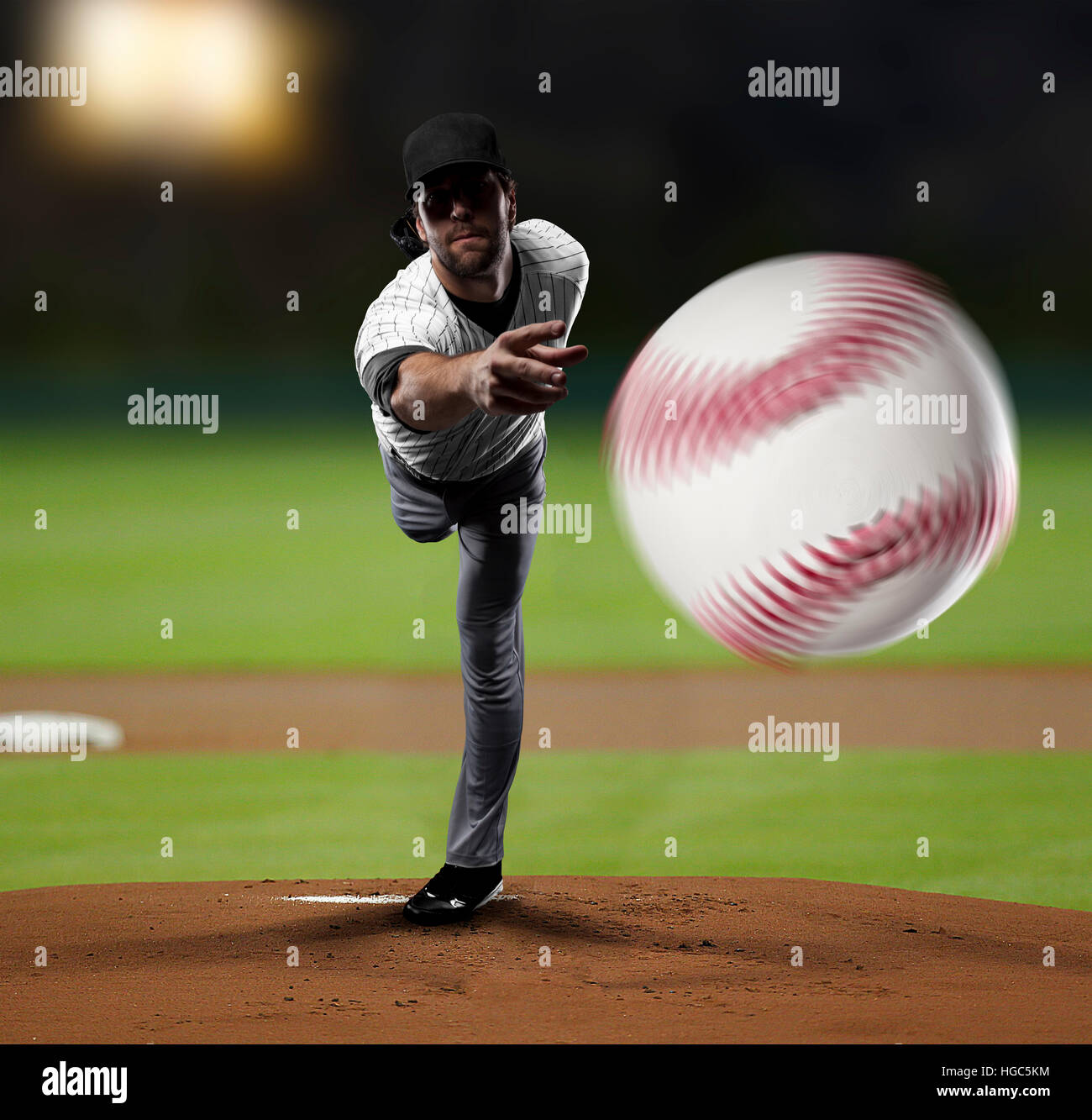 Pitcher Baseball Player with a white uniform on baseball Stadium Stock ...