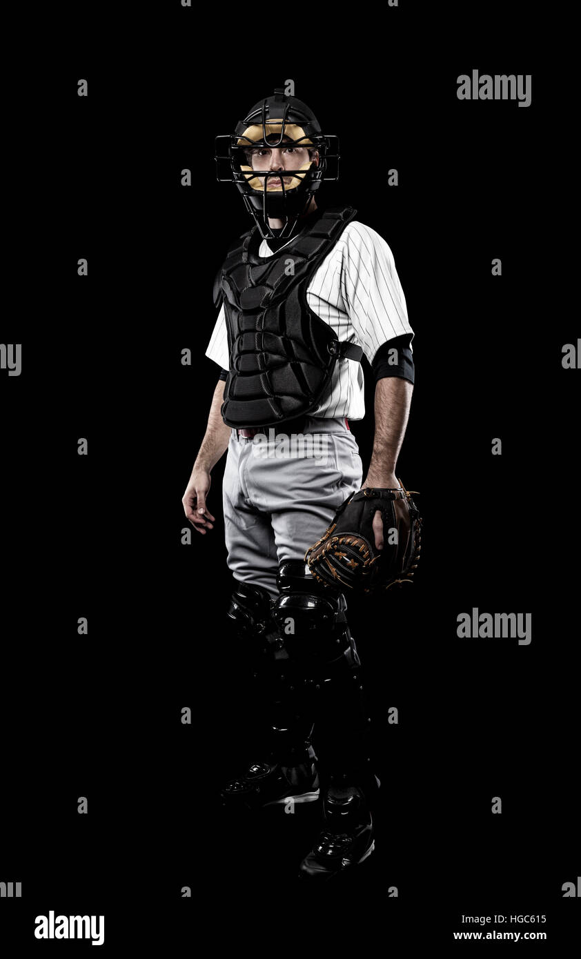 Catcher Baseball Player with a white uniform on a black background ...