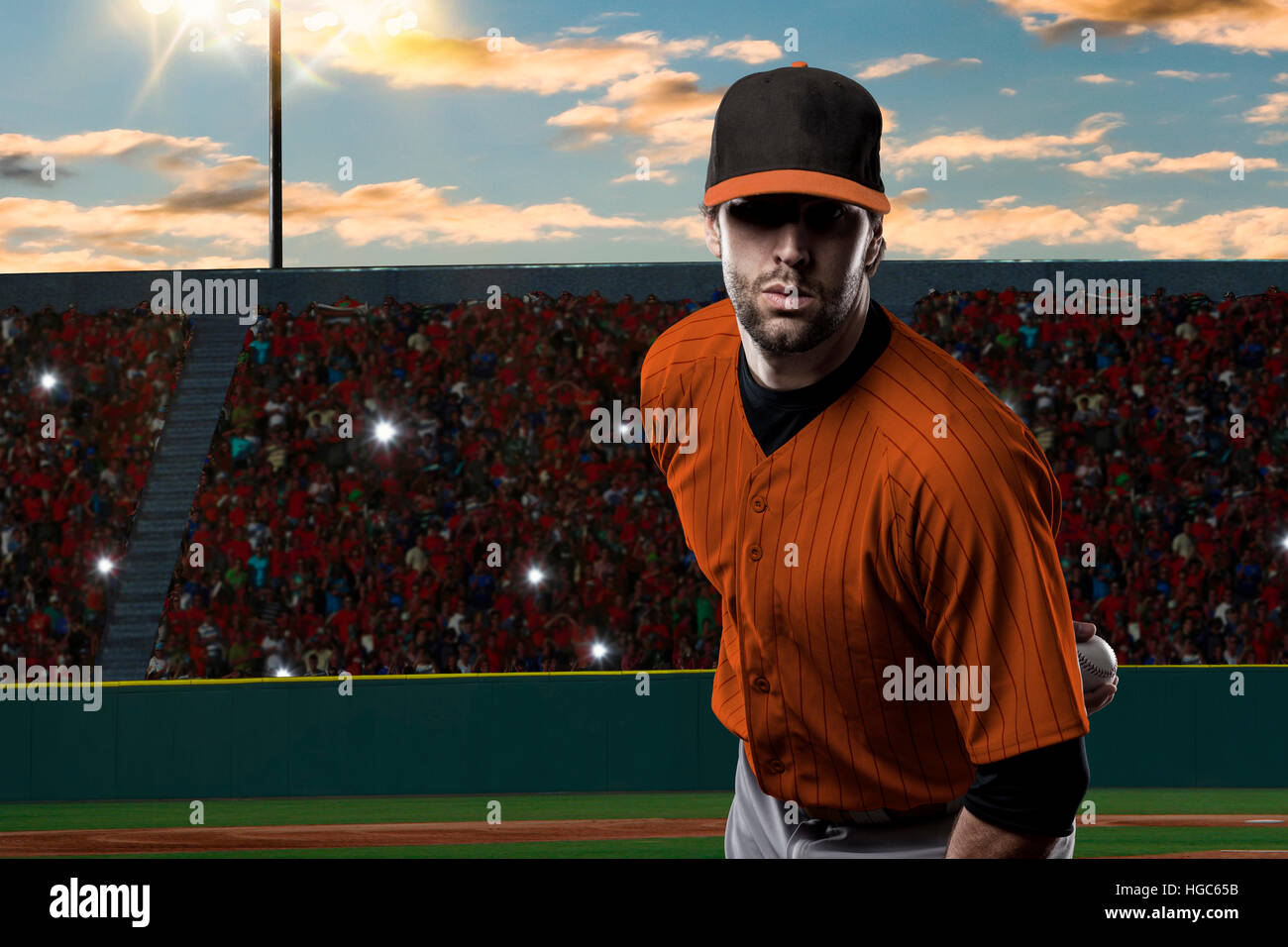 Pitcher Baseball Player with a orange uniform on baseball Stadium Stock ...