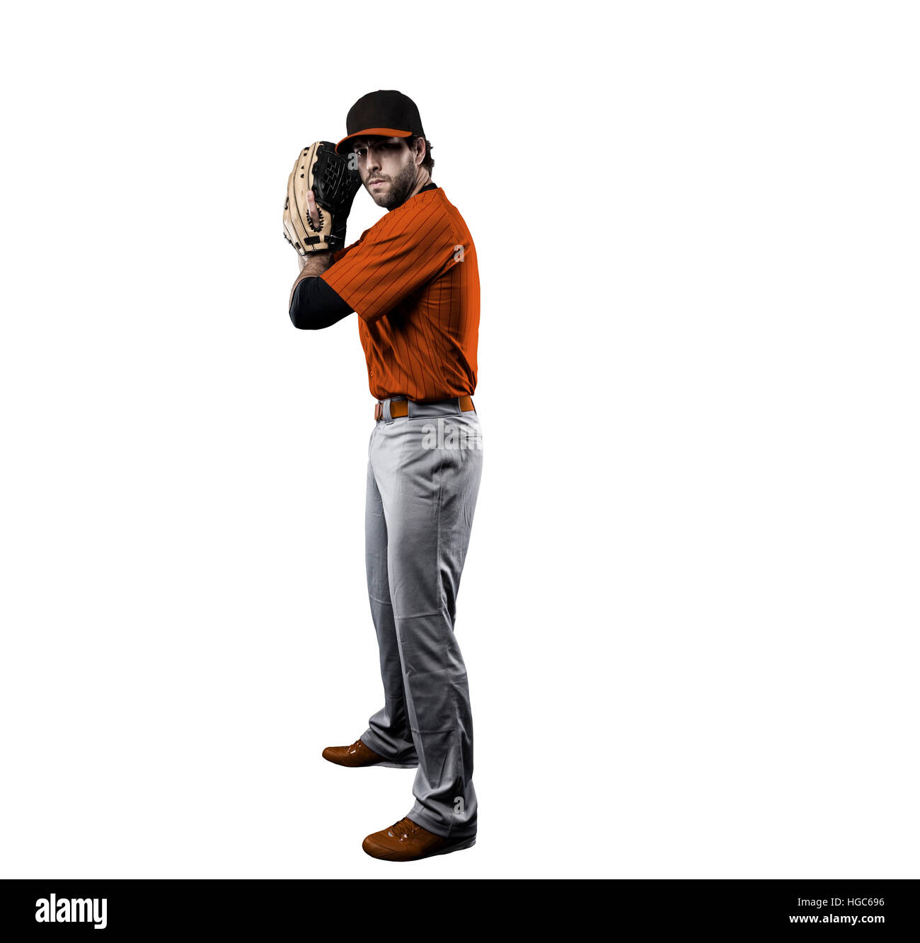 Pitcher Baseball Player with a orange uniform on a white background ...