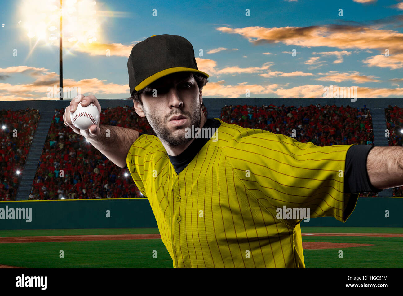 Baseball Player with a yellow uniform on baseball Stadium Stock Photo ...