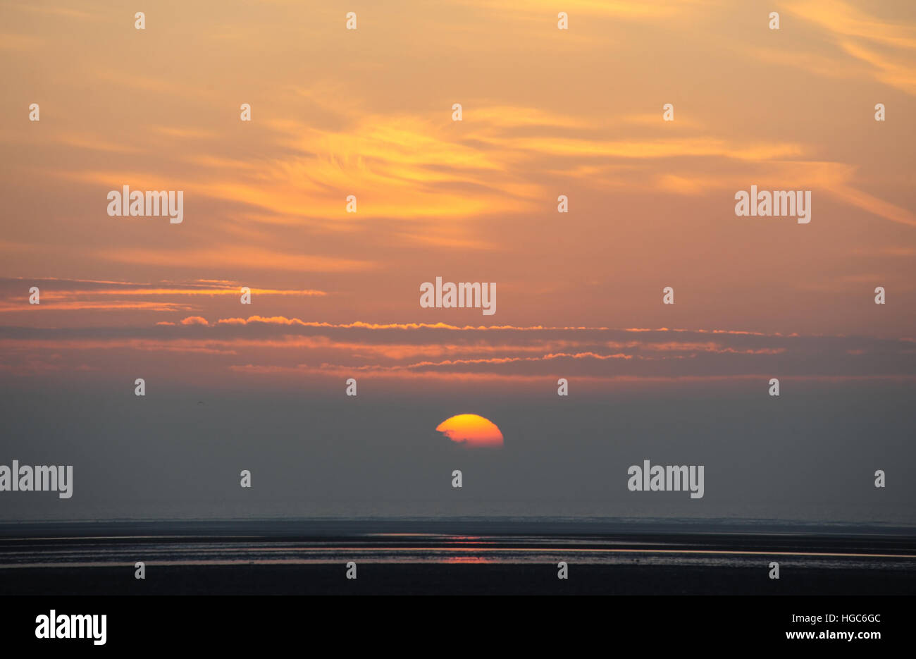 Sun 1 red sun setting orange sky centre background hi-res stock ...