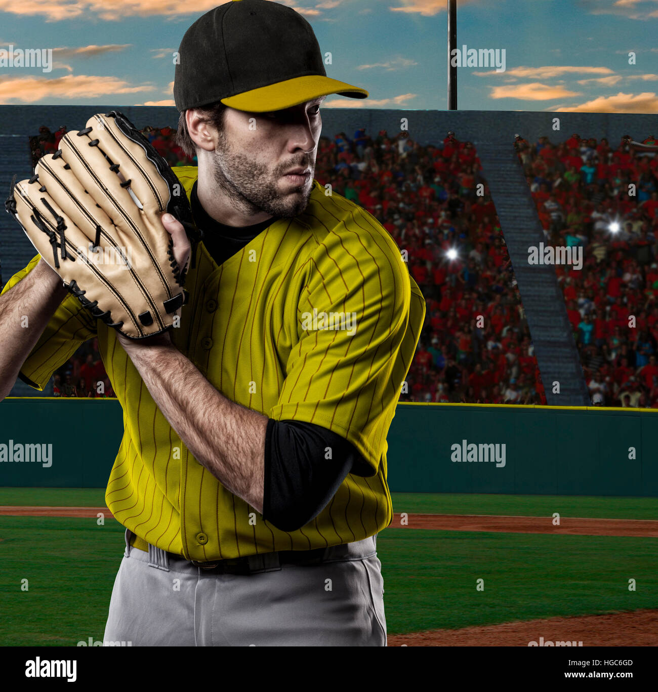 Pitcher Baseball Player with a yellow uniform on baseball Stadium Stock ...
