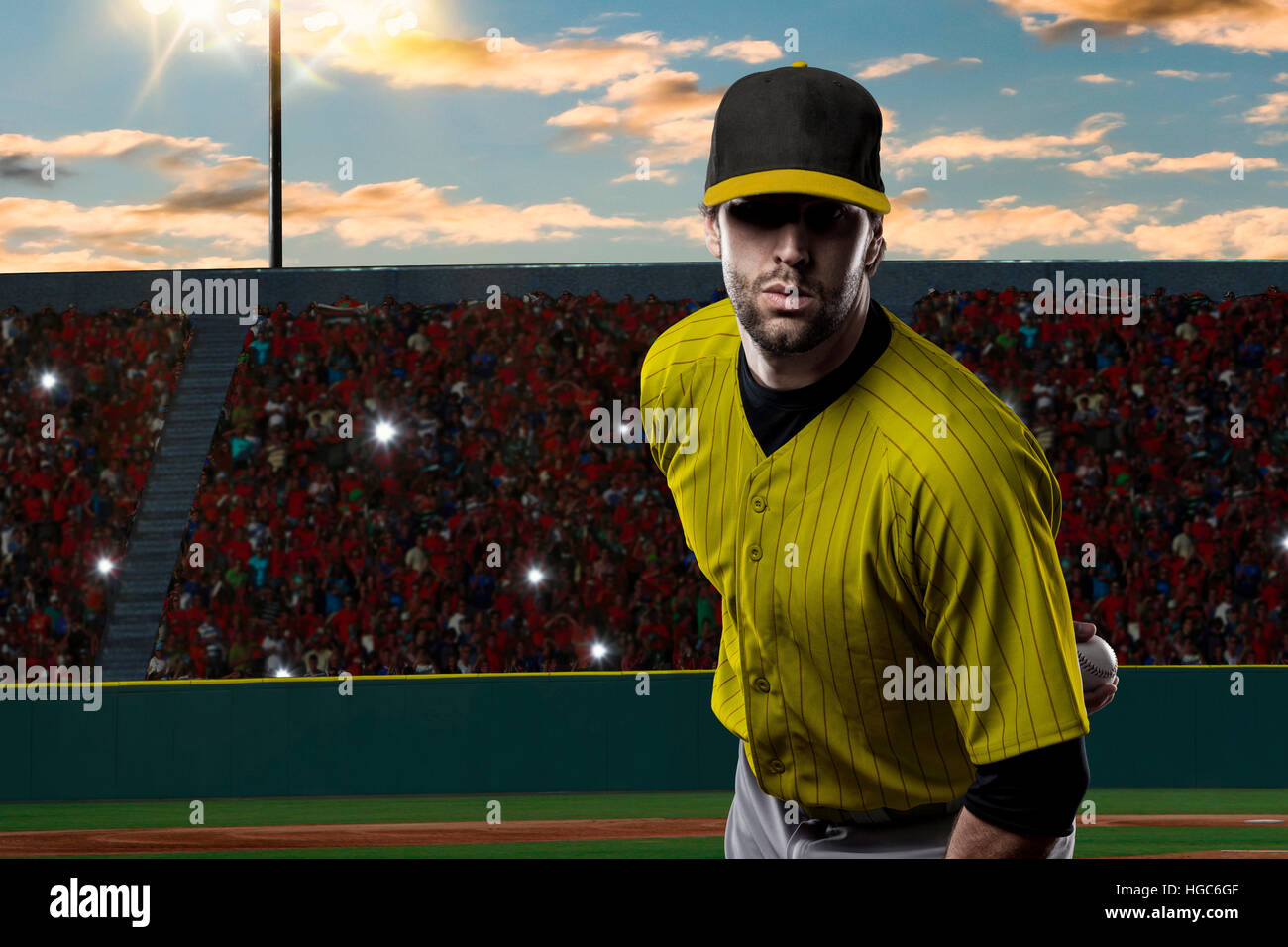 Pitcher Baseball Player with a yellow uniform on baseball Stadium Stock ...