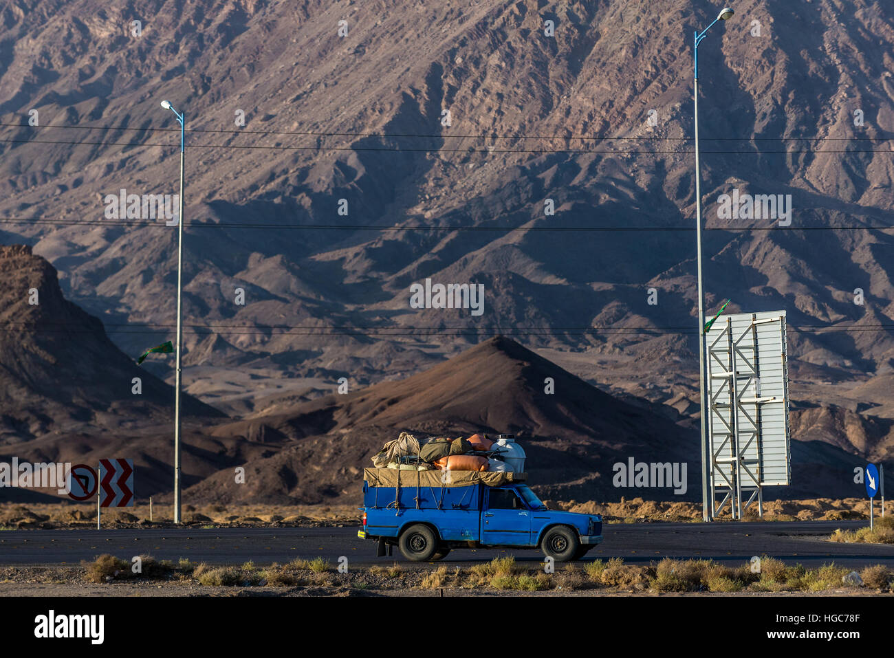 Fully loaded car on the road in Yazd Province, Iran Stock Photo - Alamy