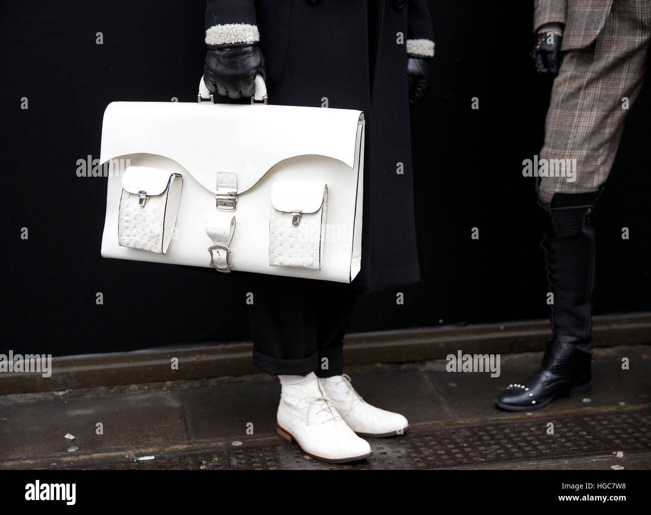 Florin Dobre, from Bucharest, holds a bag designed by Mr. Mister during ...