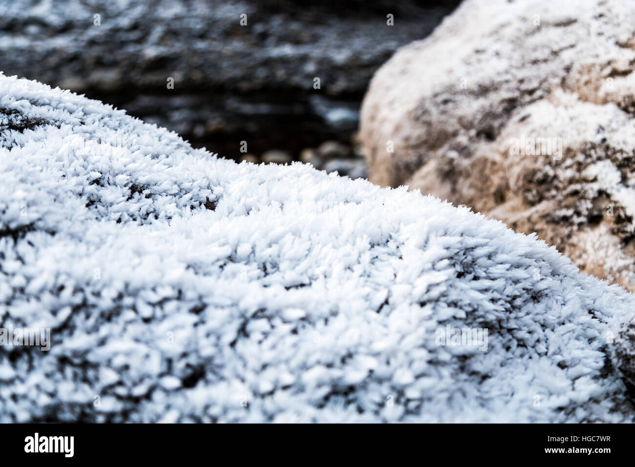 Frozen rocks with frost over them Stock Photo - Alamy