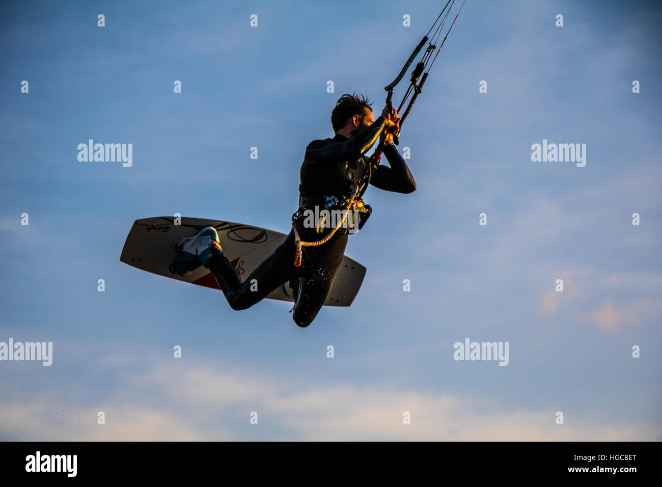 A Kitesurfer catching air Stock Photo - Alamy