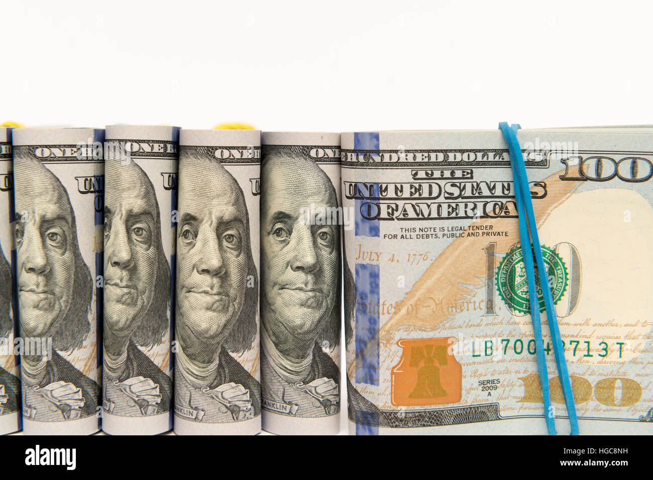 Packs of hundred dollar banknotes with rubber bands Stock Photo - Alamy