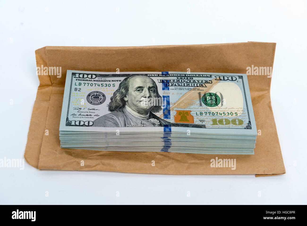 Stack of hundred dollar bills banknotes and envelope Stock Photo - Alamy
