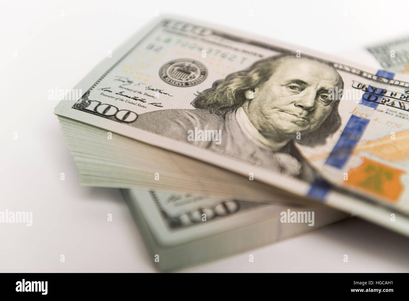 Stack of cash money in hundred dollar banknotes Stock Photo - Alamy