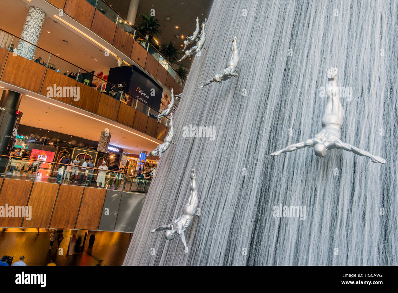 The Waterfall adorned with fibreglass sculptures of divers inside Dubai ...