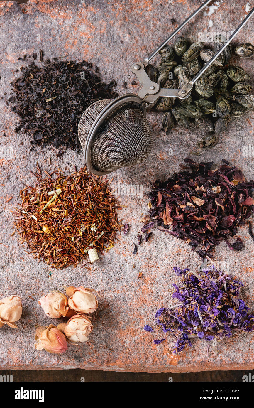 Variety of dry tea with teapot Stock Photo - Alamy