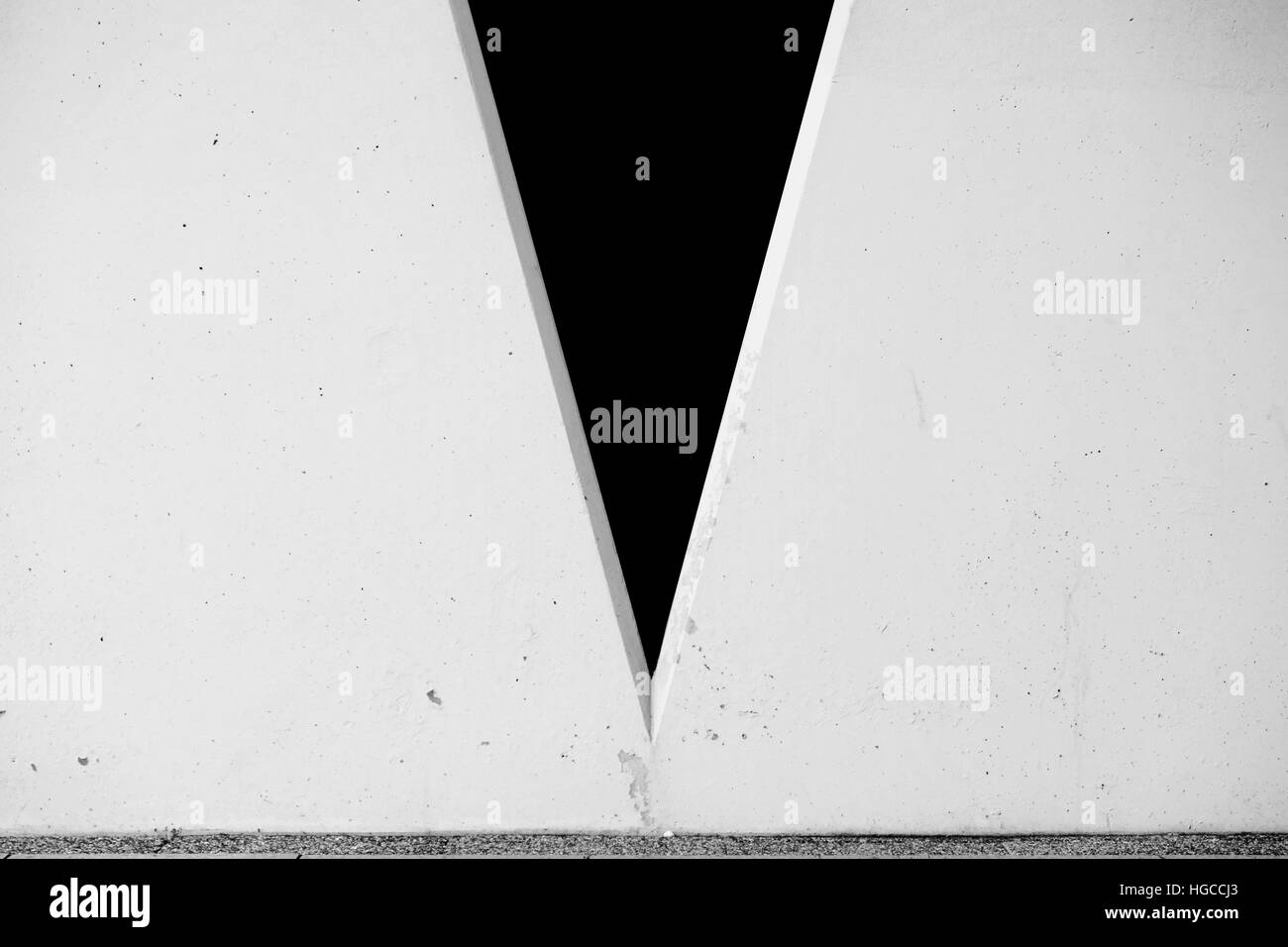 Textured wall with a V-shape black center Stock Photo - Alamy