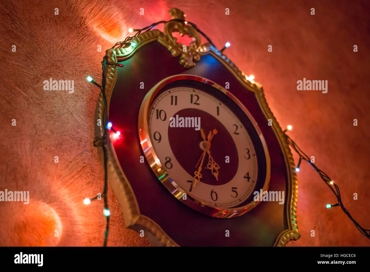 Christmas background with lights on the old clock Stock Photo - Alamy