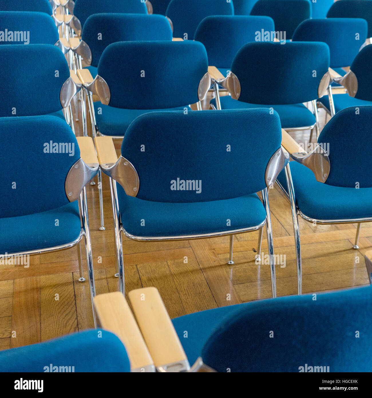 Seating with modern, blue chairs Stock Photo - Alamy