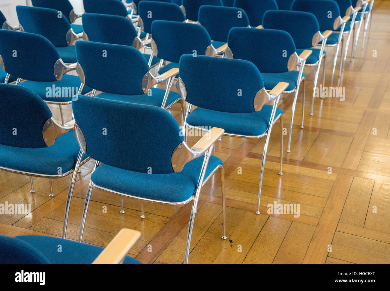 Seating with modern, blue chairs Stock Photo - Alamy